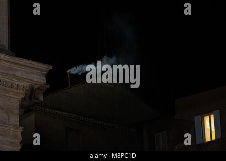 White smoke rises from the chimney of the Sistine Chapel in the Vatican ...