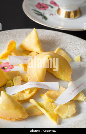 Plate with fortune cookies on beige background. Valentine's Day ...