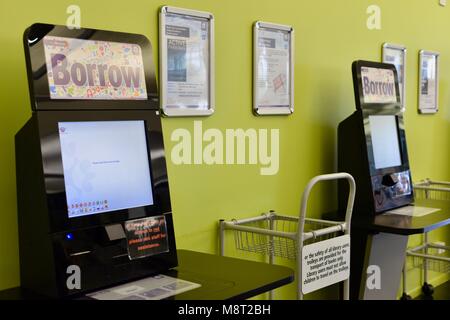 Borrow sign and borrowing booths at a library, CityLibraries Aitkenvale ...