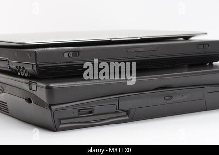 Comparing of laptops, new modern and old laptops, present and past ...