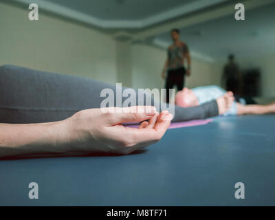 Group of sporty people in Dead Body pose Stock Photo - Alamy