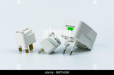 Set of universal plug adapters for travel around the world isolated on ...