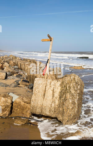March 20 2018 Hemsby, UK. Coast path sign left abandoned by coastal ...