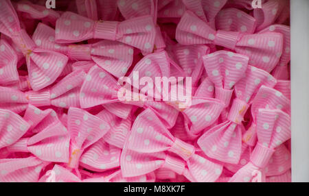 Collection of pink color bows with dots in view Stock Photo - Alamy
