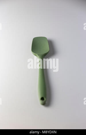 green spoon plastic isolated on white background Stock Photo - Alamy