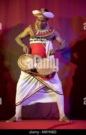 sri lankan traditional drummer playing a traditional drum called ...