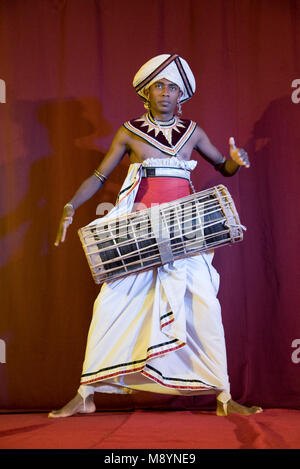 sri lankan traditional drummer playing a traditional drum called ...