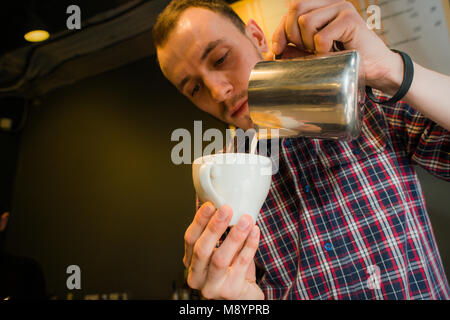 Barista, brewing coffee wit milk, latte art Stock Photo - Alamy