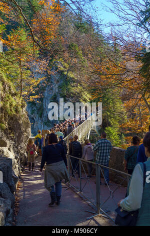 Tourists stand on Marienbruecke (Marie's Bridge) near Neuschwanstein ...