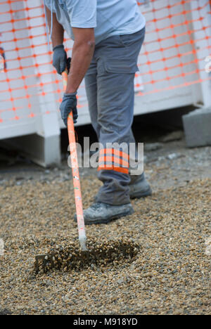 2 people sweeping up rubble Stock Photo - Alamy