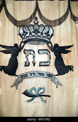 A parochet which is the curtain that covers the Torah Ark closet which ...