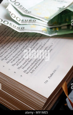 Money and religion. Holy bible and euros. | usage worldwide Stock Photo ...