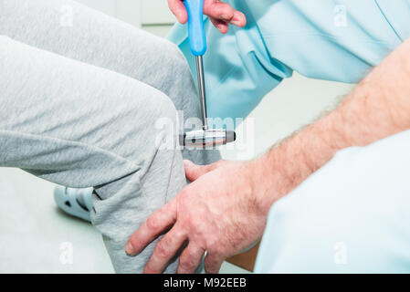 Neurological physical examination of the elbow flexion reflex. Doctor ...