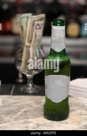 Cold beer with the bill Stock Photo - Alamy