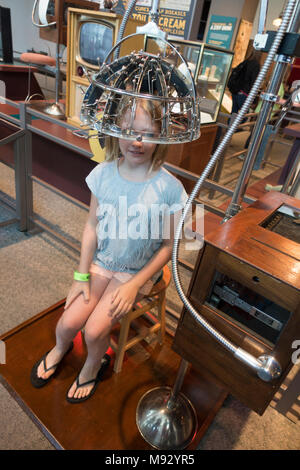 Female and child girl in the historic center in hats autumn season ...