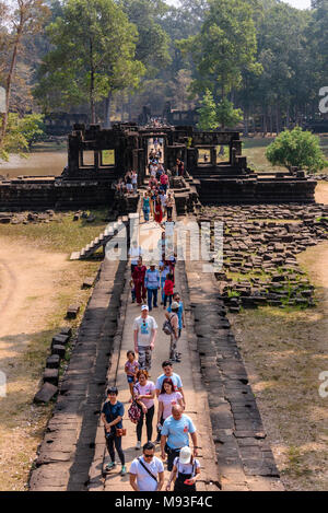 Tourists walk over a stone causeway at the Unesco World Heritage site ...