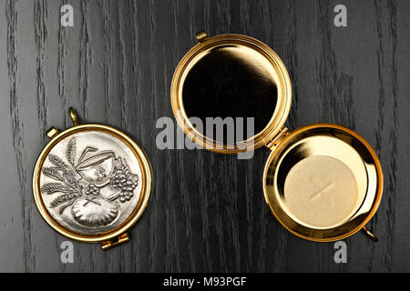Host wafer of bread to be consecrated as the Body of Christ at a Roman ...