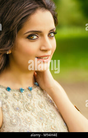 Beautiful woman hand touching neck Stock Photo - Alamy