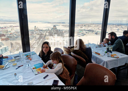 Families dining in the Ciel! rotating restaurant in Quebec City, with ...