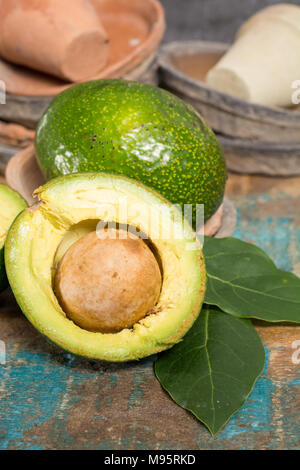Green ripe tasty Ryan avocado with big round seed, ready to eat on ...