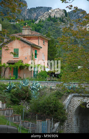 The fortified medieval village Peillon clings to a cliff face ...