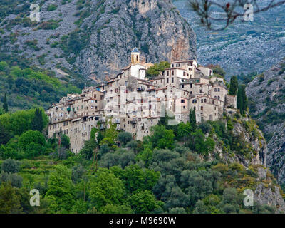 The fortified medieval village Peillon clings to a cliff face ...