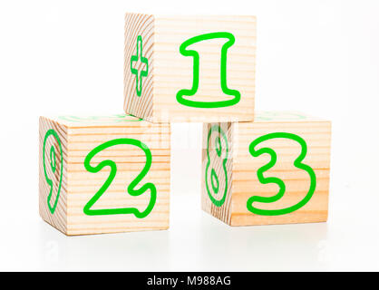 Wooden cubes with figures isolated on white Stock Photo - Alamy