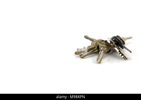 Large bunch of keys isolate on white background Stock Photo - Alamy