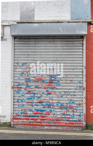 Battered closed roller shutter door with peeling paint. Metaphor closed ...