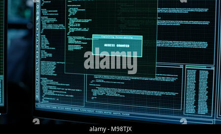Display Showing Stages of Hacking in Progress: Exploiting Vulnerability, Executing and Granted ...