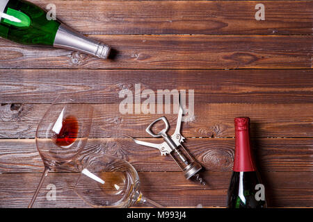 A photo of a vintage corkscrew, a cork, and a glass of wine, shot on a ...