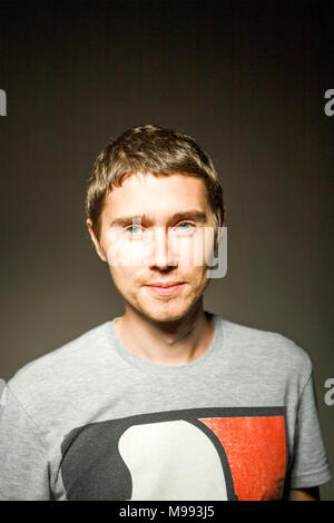 Photo of cool brunet young guy show okey blink wear brown sweater ...