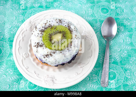 Chia seed kiwi milk rice cakes Stock Photo - Alamy