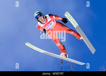 Kevin Bickner, of the United States, soars through the air during his ...