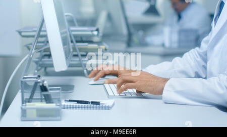 Close up of working medical doctor typing on laptop computer Stock ...