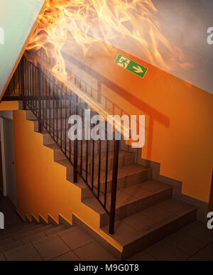 A staircase or fire escape in an office building with red painted Stock ...