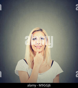 Pretty girl face daydreaming. Pensive young woman thinking in ...