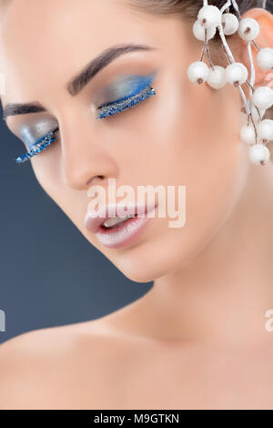 tender woman with hair accessory, christmas pine cones, winter makeup ...