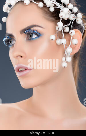 tender woman with hair accessory, christmas pine cones, winter makeup ...