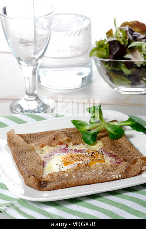 Breton crepe with egg in a white plate Stock Photo - Alamy