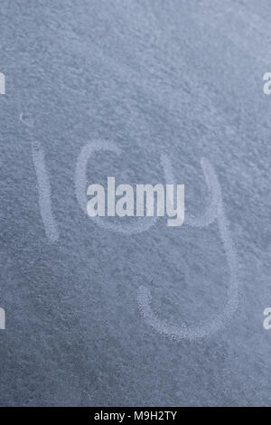 Writing on frozen windscreen Stock Photo - Alamy