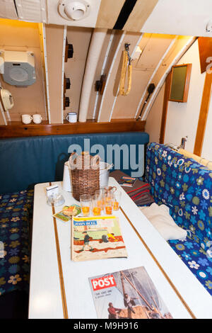 Inside accommodation cabin / room with mess table, seats, bunks, etc ...