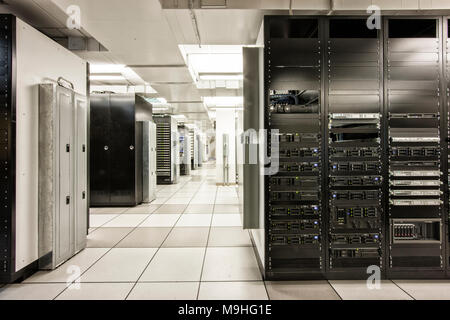 Storage racks aligned in a computer server room Stock Photo - Alamy