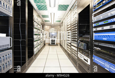 Storage racks aligned in a computer server room Stock Photo - Alamy