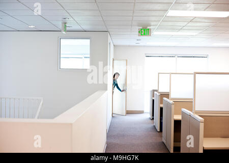 Office worker coming into cubicle work area of new office Stock Photo ...