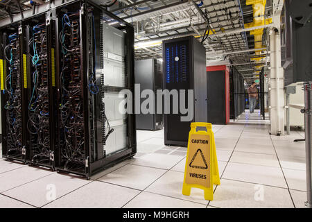 Racks of servers aligned in rows in a large computer server farm Stock ...