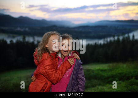 Friendly hug in the summer sunny day Stock Photo - Alamy