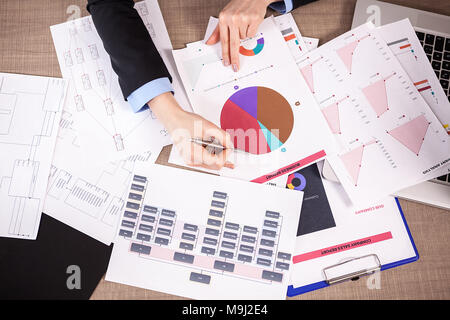 Multiple charts and diagrams on the table Stock Photo - Alamy