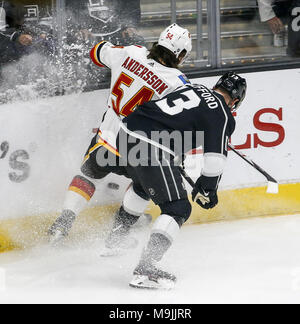 Calgary Flames defenseman Rasmus Andersson (4) and Buffalo Sabres right wing Alex Tuch (89) race ...
