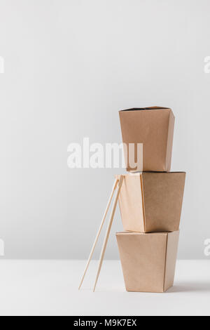 three noodles boxes with chopsticks on table Stock Photo - Alamy